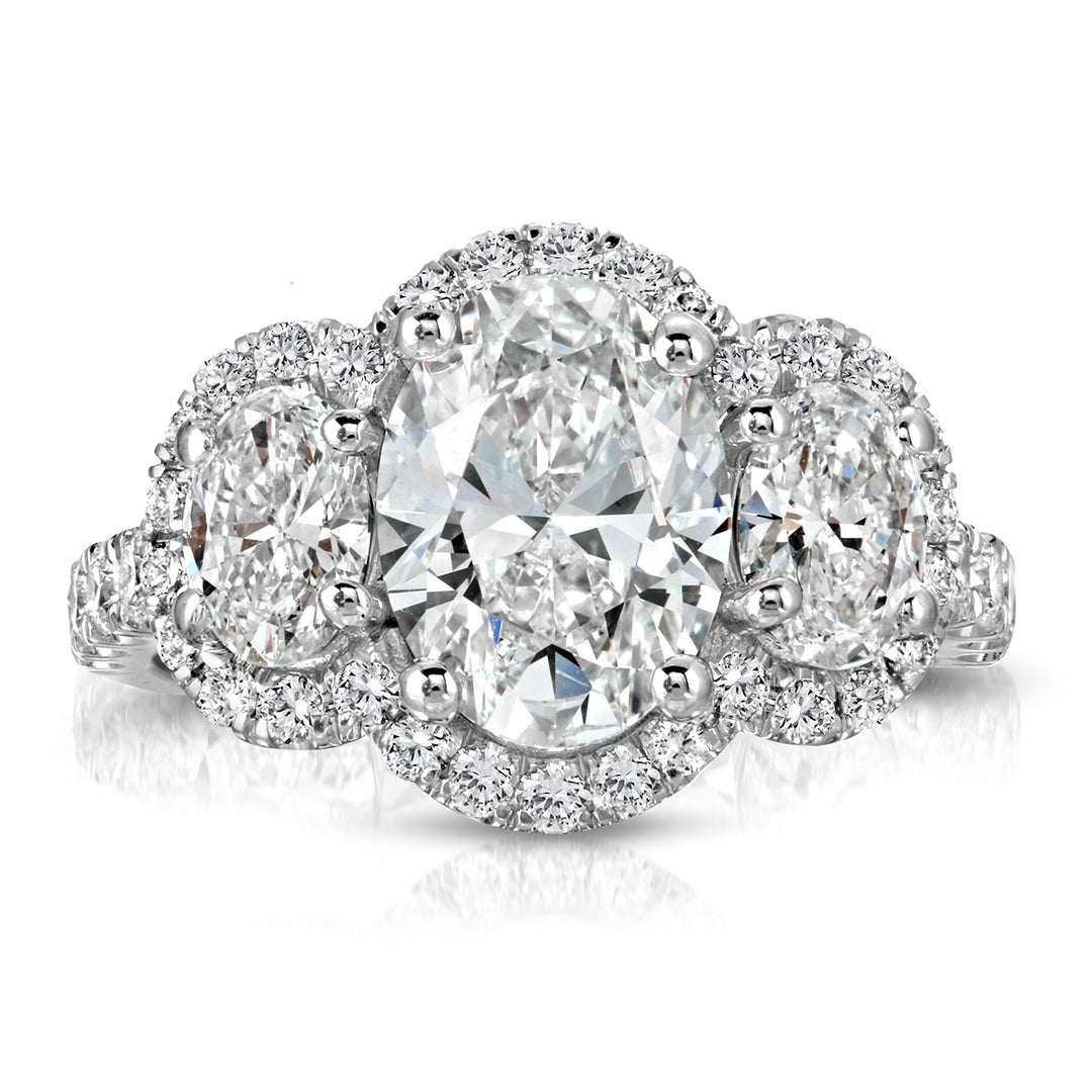 Halo Three Stone Oval Engagement Ring in White Gold | The Better Diamonds
